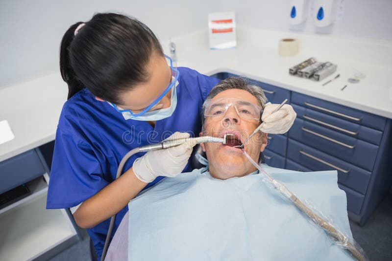 Dentist Examining a Patient with Tools Stock Image - Image of view ...