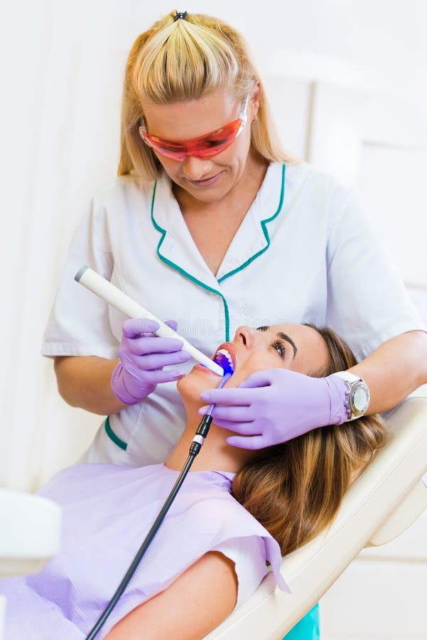 Dentist Examining Teeth at Dental Office Stock Photo - Image of dental ...
