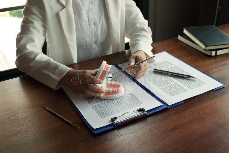 The Dentist Has Shown the Use of Dental Tools with Samples Tooth Model ...