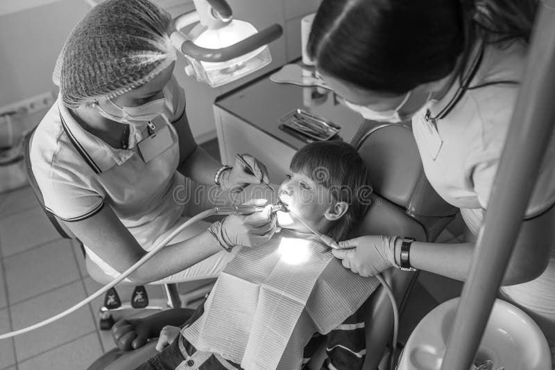 Dentist and Nurse Curing Childe Teeth Stock Image - Image of medic ...