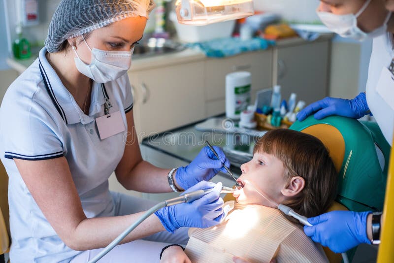 Dentist and Nurse Curing Childe Teeth Stock Image - Image of medicine ...