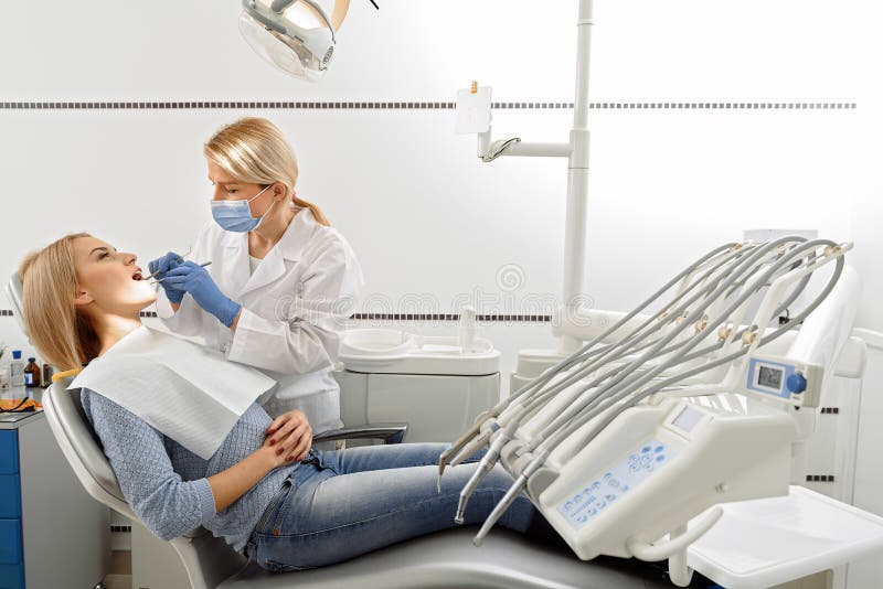 Dentist Operating Tools in Oral Cavity of Patient Stock Photo - Image ...