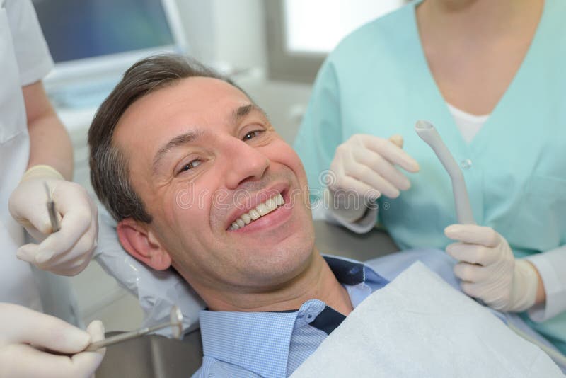 Dentist and Patient Smiling Stock Image - Image of smiling ...