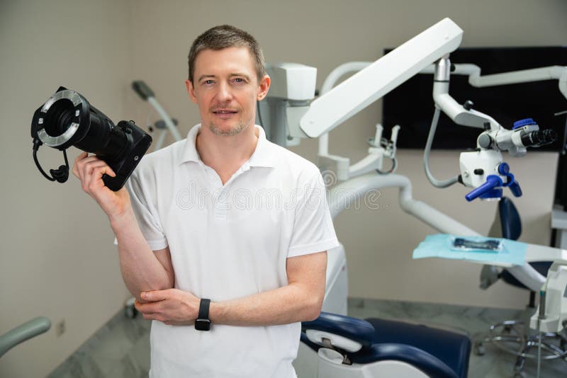 Dentist with Photo Camera in Dental Office Stock Image - Image of ...