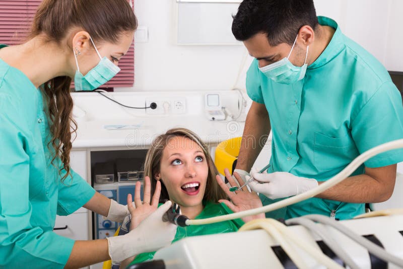 Dentist and scared patient stock image. Image of adult - 54564227