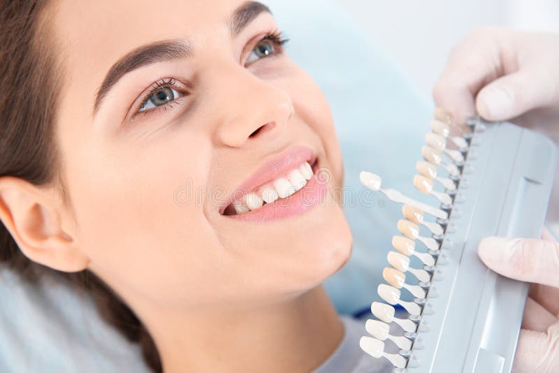 Dentist Selecting Patient`s Teeth Color with Palette Stock Photo ...