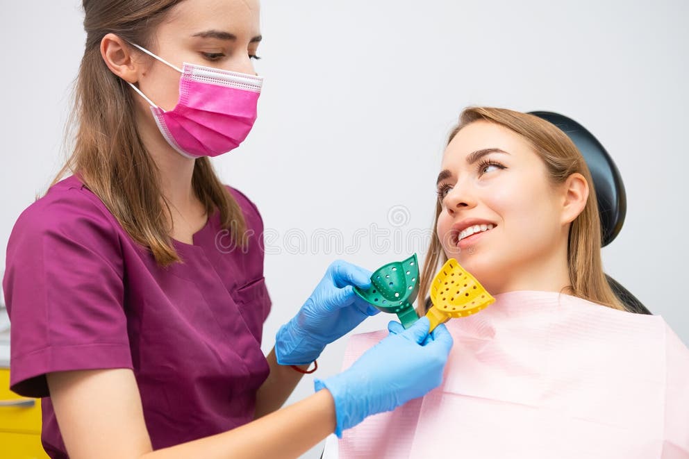 Dentist Selects Plastic Mold for Making Impressions for Orthodontic ...