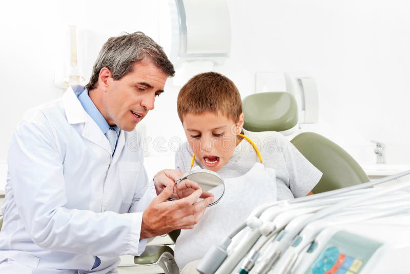 Dentist Talks To Child in Practice Stock Photo - Image of doctor ...