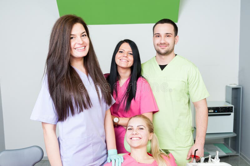 Dentist Team and Smiling Patient Stock Photo - Image of medical, office ...