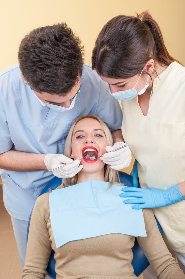 Dental Team at Work on a Dentist Office Stock Photo - Image of human ...