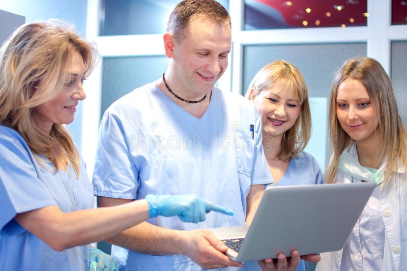 Dentist Team Working Together in Dental Office. Stock Photo - Image of ...