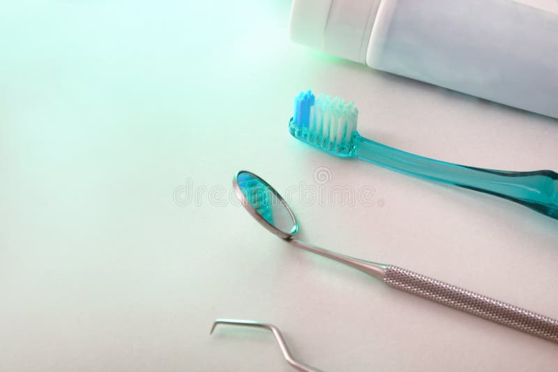 Dentist Tools on Table with Green Light Elevated Stock Image - Image of ...