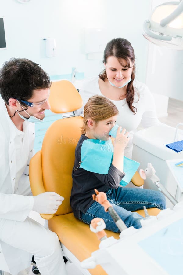 Dentist Treating Child in His Surgery Stock Photo - Image of teeth ...