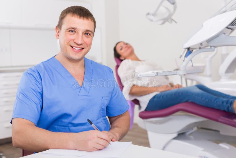 Dentist in Uniform Writing Document Stock Image - Image of practitioner ...