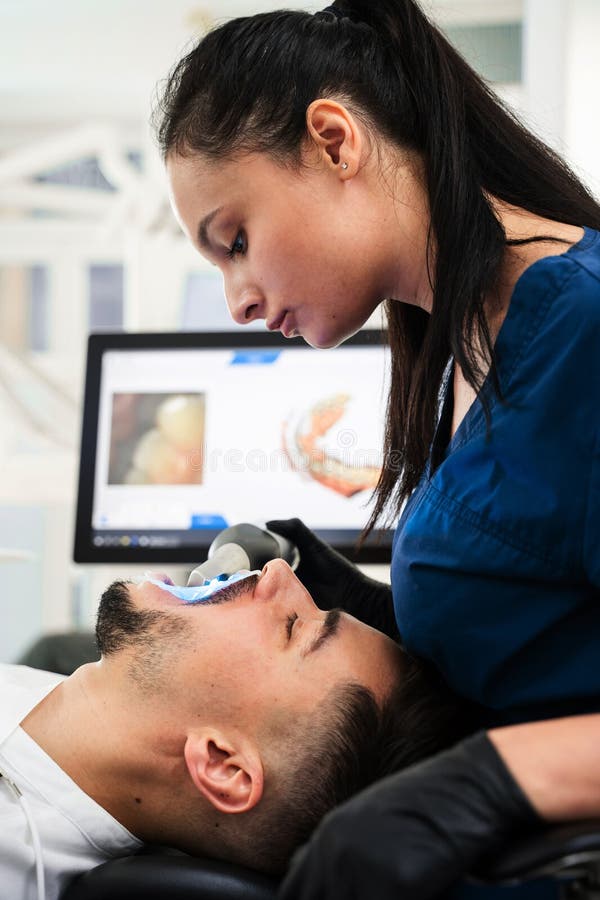 Dentist Uses Dental Scanner To Examine Teeth of the Patient. Digital ...