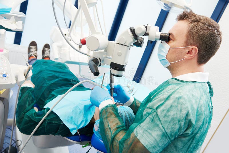 Dentist Using Microscope for Operation Stock Image - Image of ...