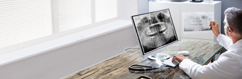 Dentist Using Oral Software Looking at Teeth Xray Stock Image - Image ...