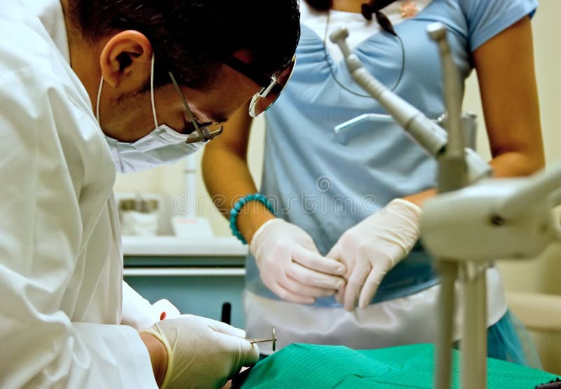 Dentist at work stock photo. Image of shirt, coat, dentist - 12960526