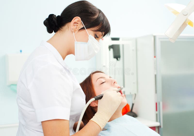 Dentist at work stock image. Image of clinical, oral - 17034531