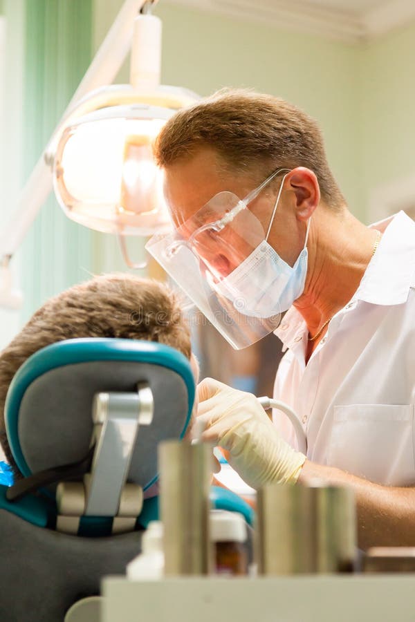 Dentist at work stock photo. Image of caucasian, mouth - 15838784