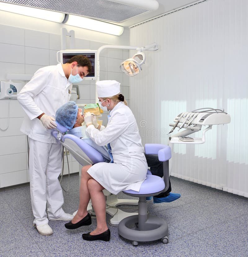 Dentist at work stock image. Image of clinical, oral - 17034531