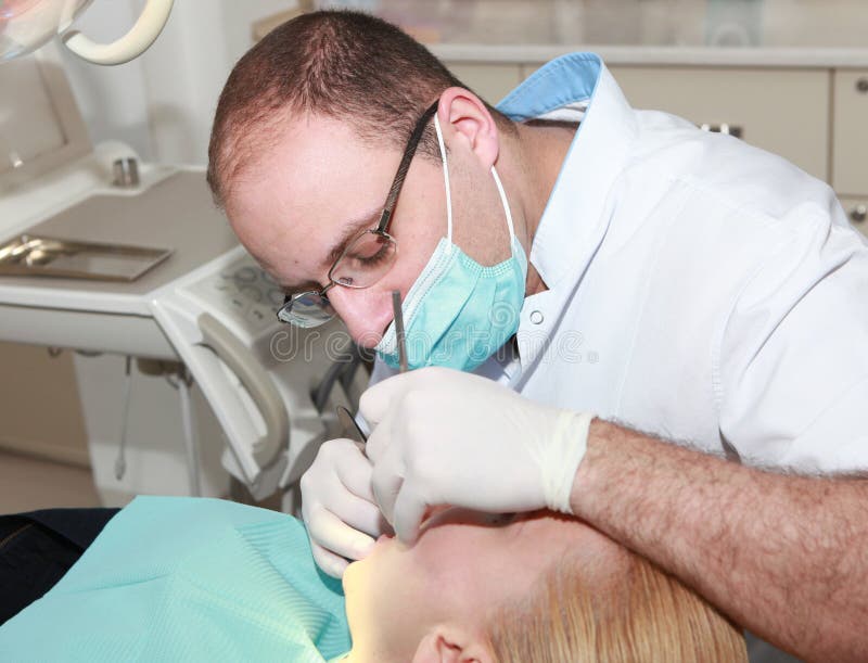 Dentist at work stock photo. Image of caucasian, mouth - 15838784