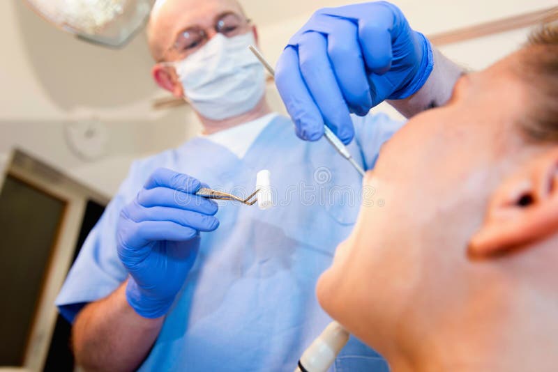 Dentist at work stock photo. Image of health, people - 10043010