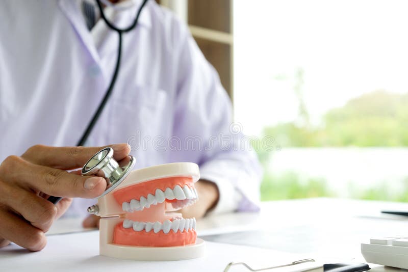 Dentist Work on the Table with Denture and Teeth X-ray Stock Photo ...