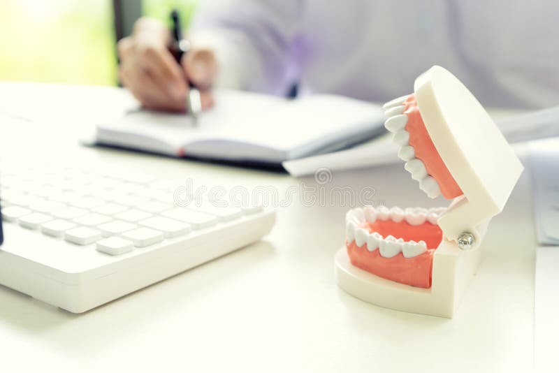 Dentist Work on the Table with Denture and Teeth X-ray Stock Photo ...