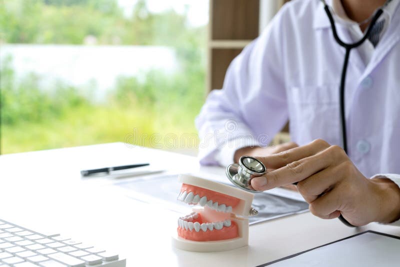 Dentist Work on the Table with Denture and Teeth X-ray Stock Image ...