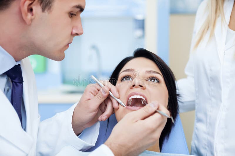 Dentist at work stock image. Image of orthodontic, assistance - 3397719