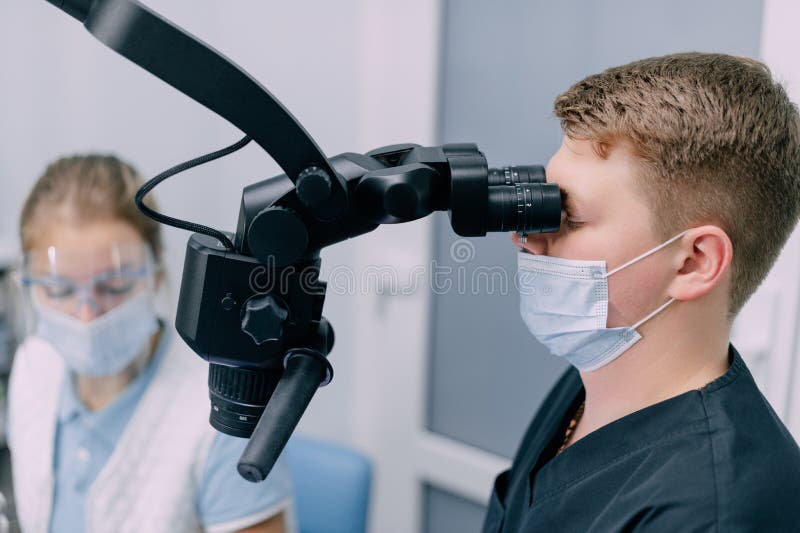 Dentist Works with Microscope. Stock Image - Image of tooth, office ...