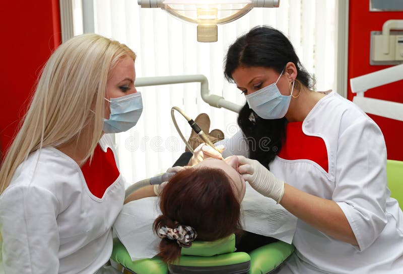 Dentists at work stock image. Image of healthcare, equipment - 37039111