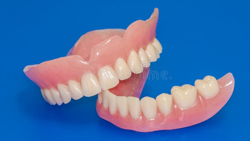 Dentures on a Blue Background Stock Image - Image of removable ...