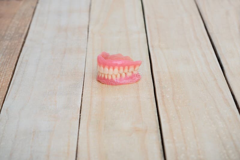 Dentures on wooden table stock image. Image of view, orthodontist ...