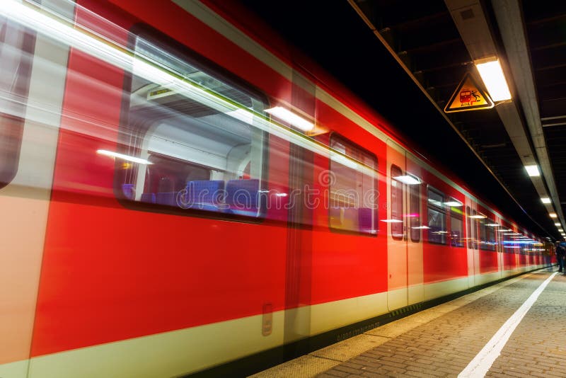 Departing Train at Railway Station Stock Photo - Image of motion, long ...