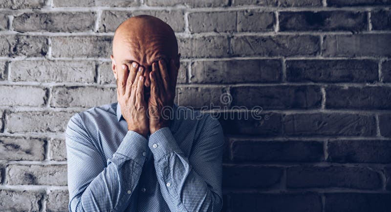 Crying Man in Front of the Grey Brick Wall during Finacial Crisis Stock ...