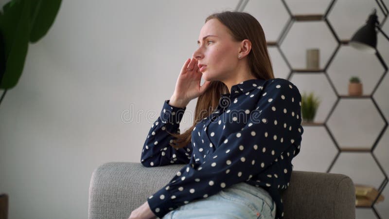 Depressed and Dejected Woman Sitting on the Sofa in the House Stock ...