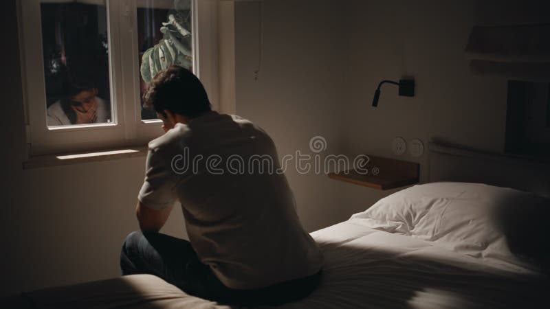 Depressed Guy Sitting Bedding by Window at Night Feeling Anxious ...