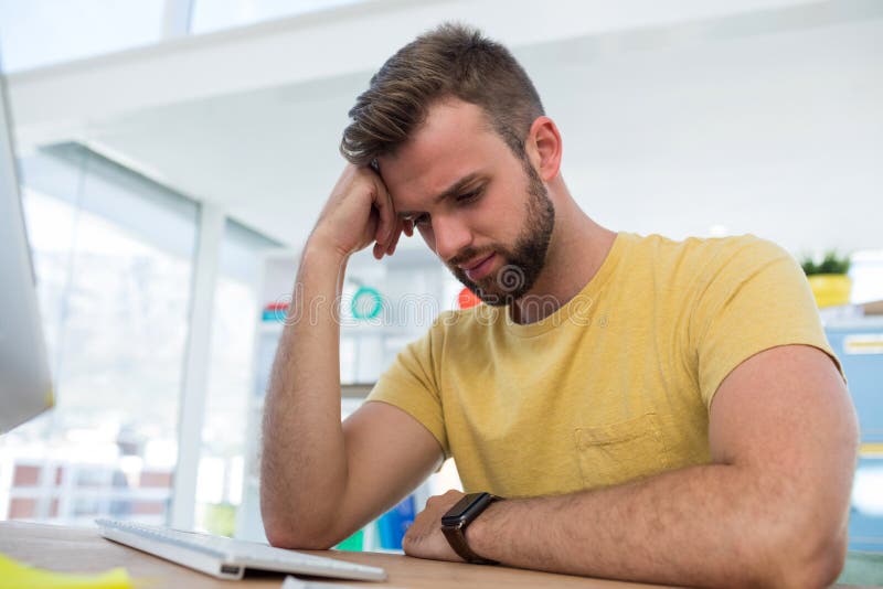 Depressed Male Executive Working on Computer Stock Image - Image of ...