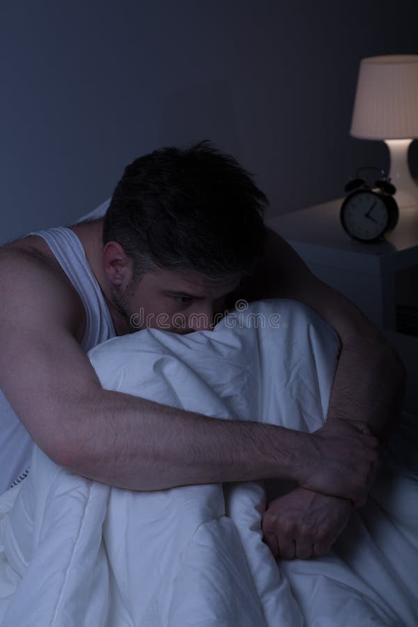 Depressed man alone in bed stock image. Image of stress - 62288767