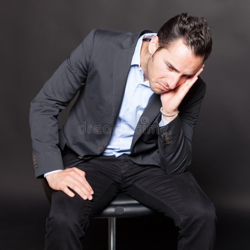 Depressed man on a chair stock photo. Image of crisis - 40712038