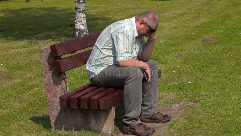Depressed Man Crying in the Park on Bench Stock Footage - Video of ...