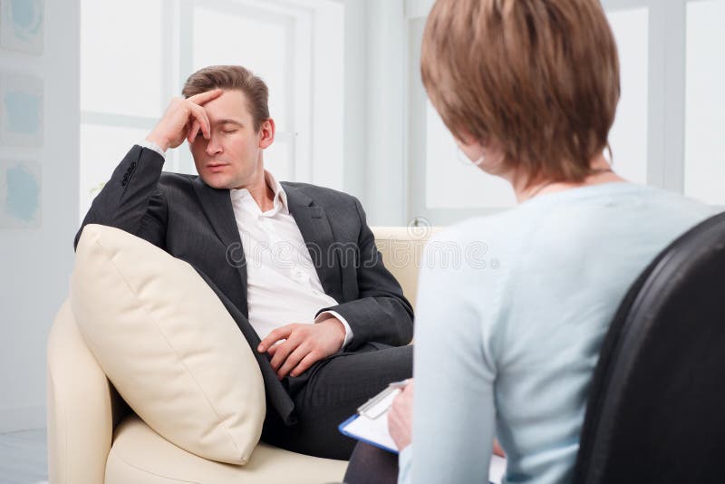 Oppressed Man Talking with Psychologist Stock Photo - Image of ...