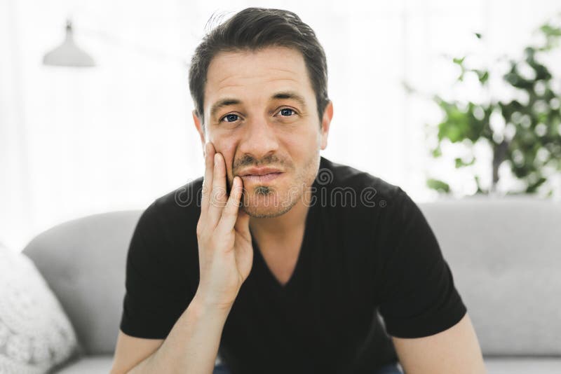 Depressed Man Thinking at Home on Couch Stock Image - Image of stress ...