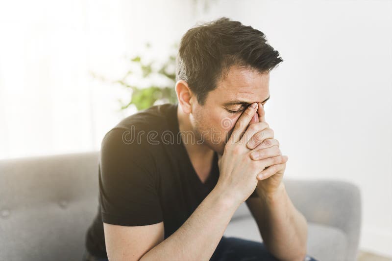 Depressed Man Thinking at Home on Couch Stock Photo - Image of ...