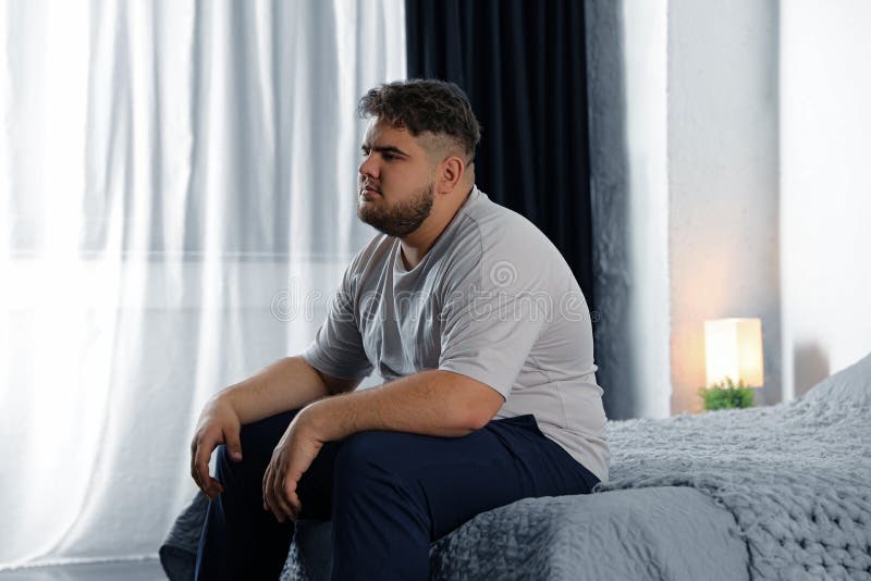 Depressed Overweight Man on Bed Stock Image - Image of lifestyle ...