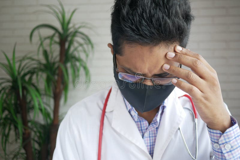 Depressed Sad Doctor Covering Face with Hands Stock Image - Image of ...