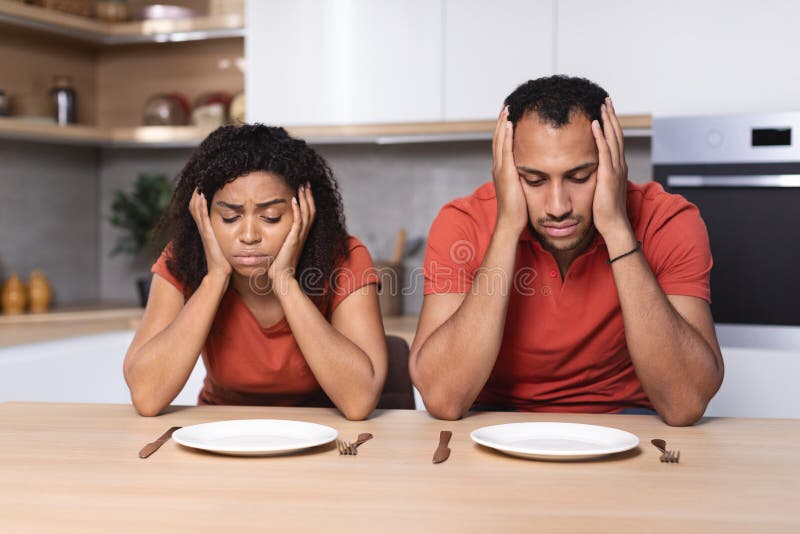 Depressed Sad Pensive Millennial African American Wife And Husband Hold