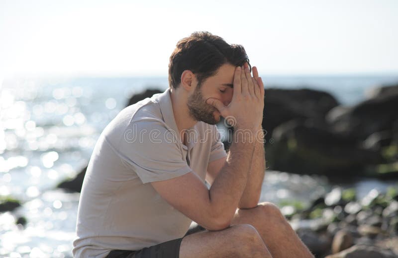 Depressed Sad Young Man Sitting on a Sea Beach Stock Image - Image of ...